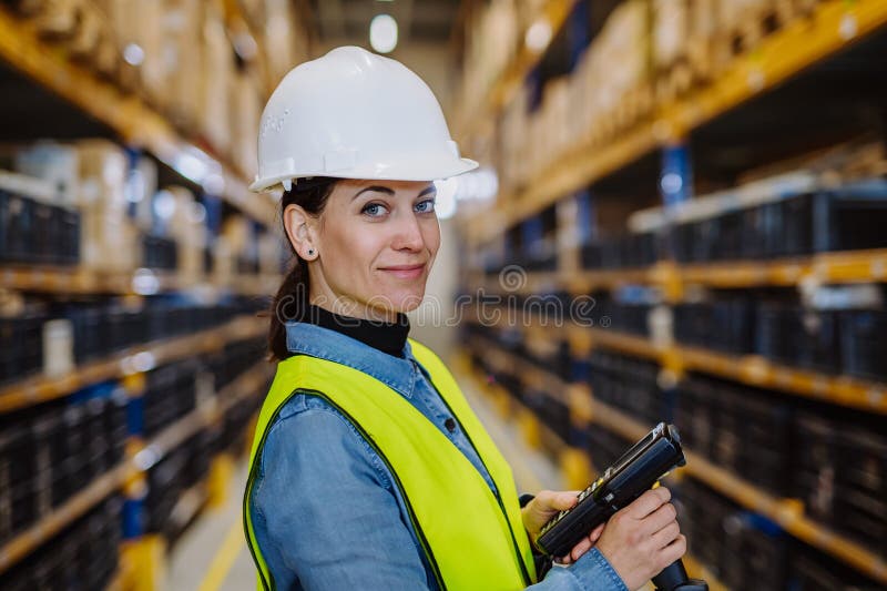 Warehouse Female Worker Checking Up Stuff in a Warehouse. Stock Photo ...