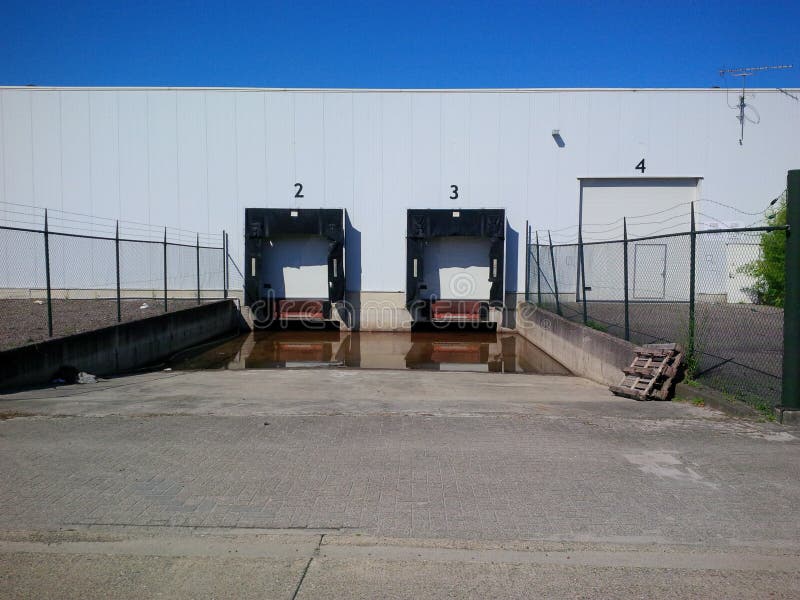 Warehouse with Flooded Loading Docks for Trucks Stock Image - Image of ...