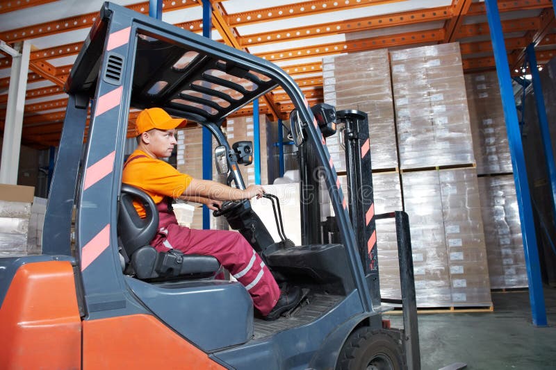 Forklift Worker in Loader at Stock Photo - Image of cardboard ...
