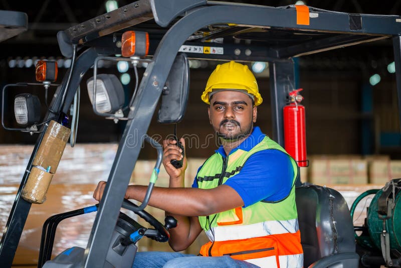 Warehouse Forklift Loader Works with Goods, Worker Man in Hardhat and ...