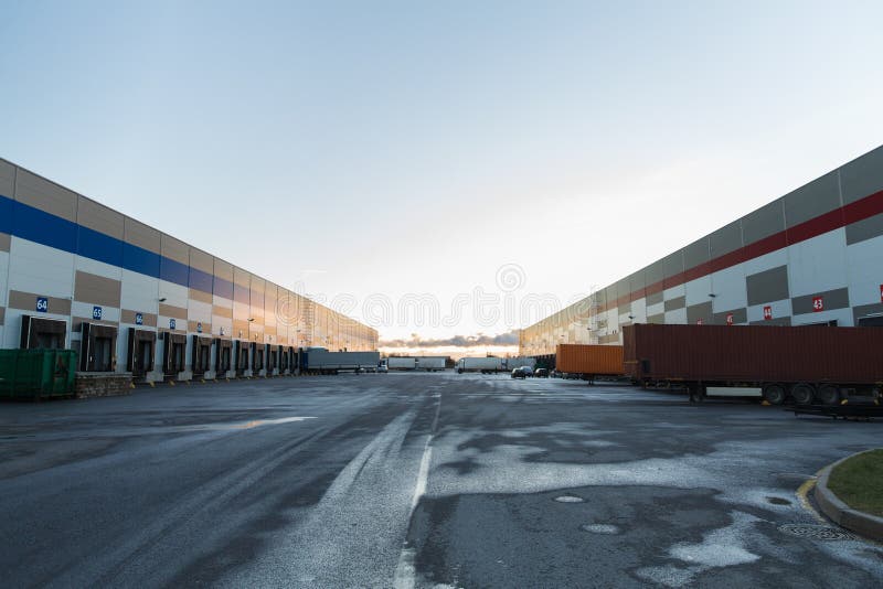 Warehouse Gates and Trucks Loading Stock Image - Image of modern ...