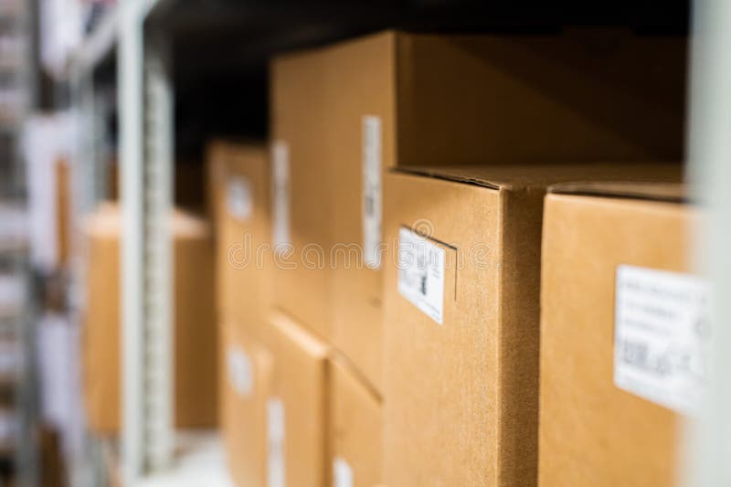 Warehouse Goods. Rows of Shelves with Goods in Cardboard Boxes, Close ...