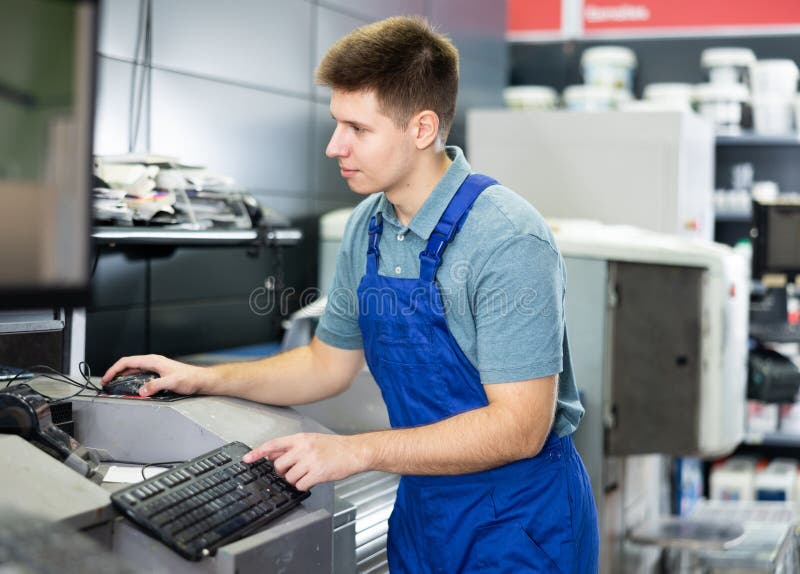 Warehouse Guy Employee Look at Computer Monitor Screen and Check ...