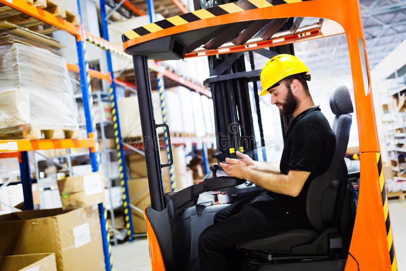 Warehouse Worker Doing Logistics Work with Forklift Loader Stock Image ...
