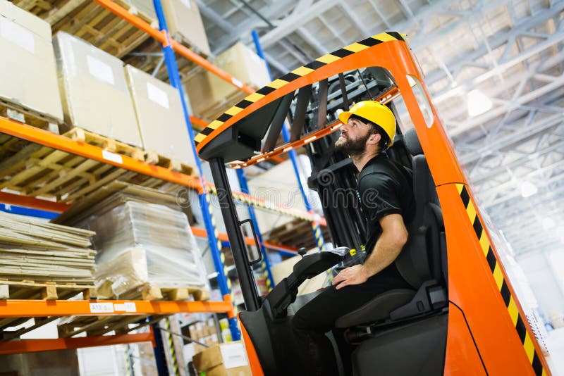 Warehouse Worker Doing Logistics Work with Forklift Loader Stock Image ...