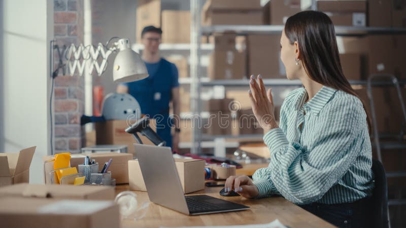 Warehouse Inventory Manager Using Laptop Computer, Preparing a Small ...