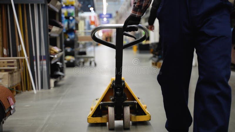 Warehouse Loader Dragging Hand Pallet Truck or Manual Forklift with the ...