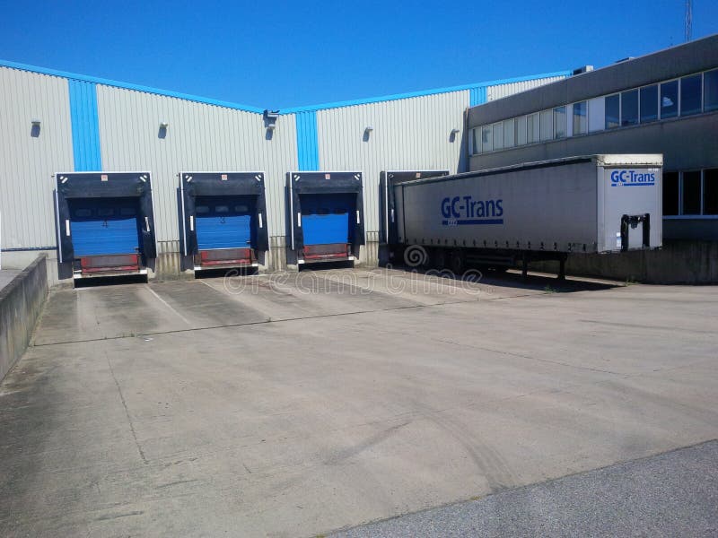 Warehouse with Loading Docks for Trucks Editorial Stock Image - Image ...