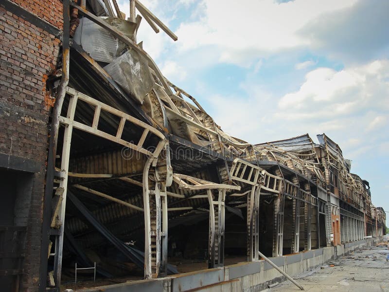 A Warehouse with a Loading Ramp after a Fire. Burnt Metal Frame of the ...