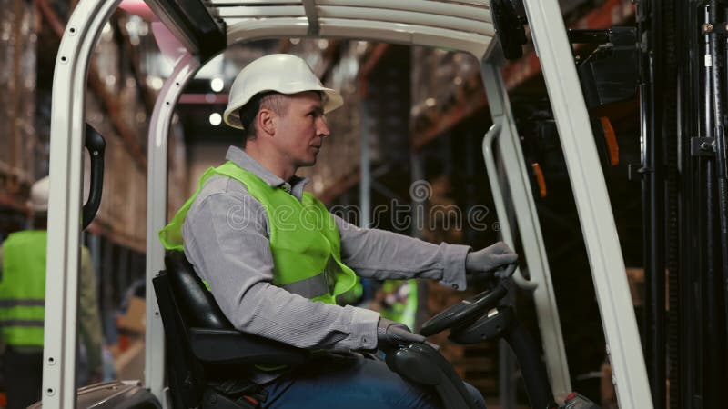 Male Warehouse Worker Operating Forklift. Stock Footage - Video of ...