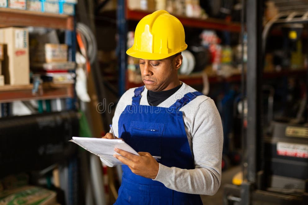 Warehouse Manager Calculates the Quantity of Goods and Writes it Down ...