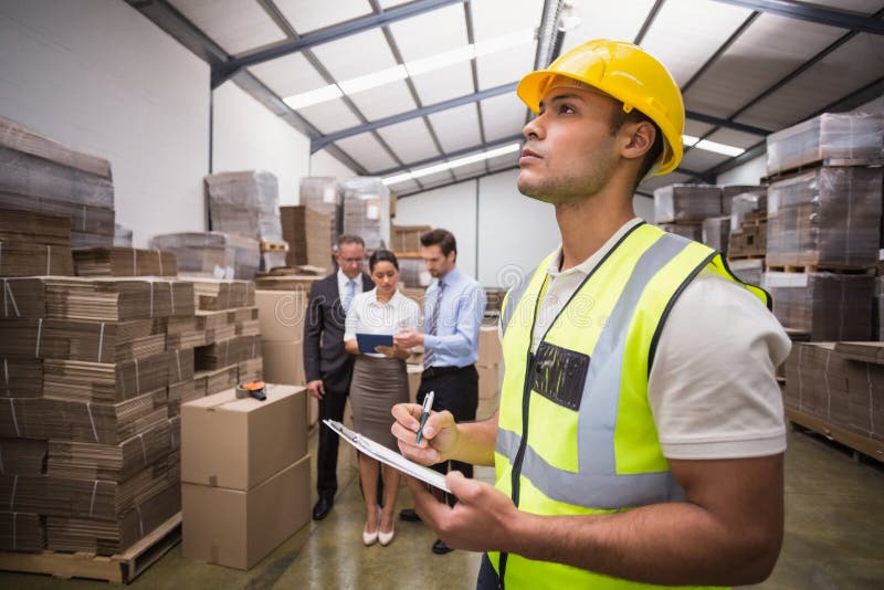 Warehouse Manager Checking His Inventory Stock Image - Image of female ...