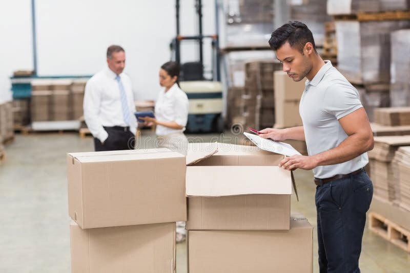 Warehouse Manager Checking His Inventory Stock Image - Image of ...