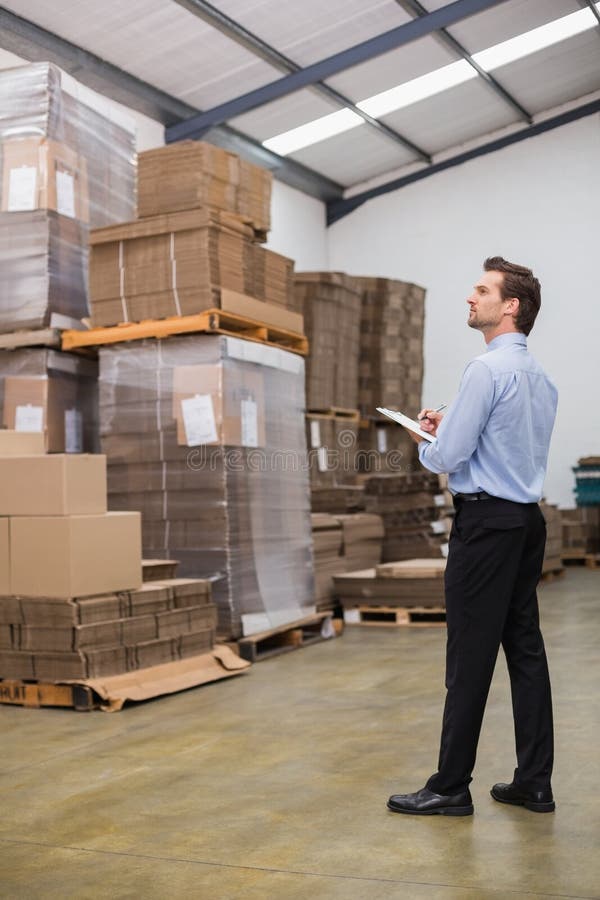Warehouse Manager Checking His Inventory Stock Image - Image of ...