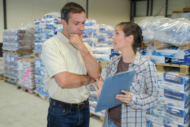 Warehouse Manager Checking Inventory in Large Warehouse Stock Photo ...