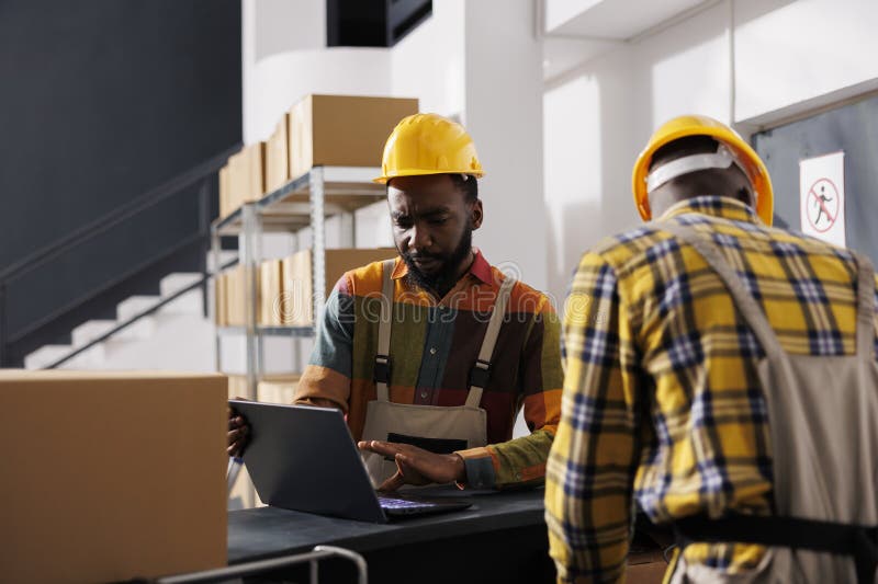 Warehouse Manager Checking Parcel Delivery Electronic Invoice on Laptop ...