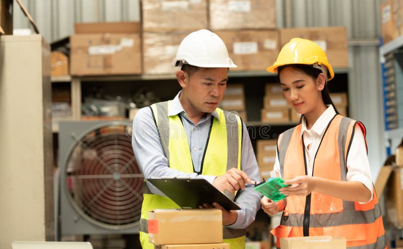 Warehouse Manager with Female Assistant Rethink a Plan To Prepare Items ... Warehouse Manager with Female Assistant Rethink a Plan To Prepare Items ...