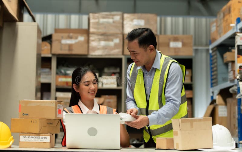Warehouse Manager with Female Assistant Rethink a Plan To Prepare Items ... Warehouse Manager with Female Assistant Rethink a Plan To Prepare Items ...