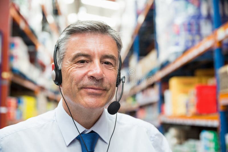 Warehouse Manager Giving Orders on Headset Stock Photo - Image of ...