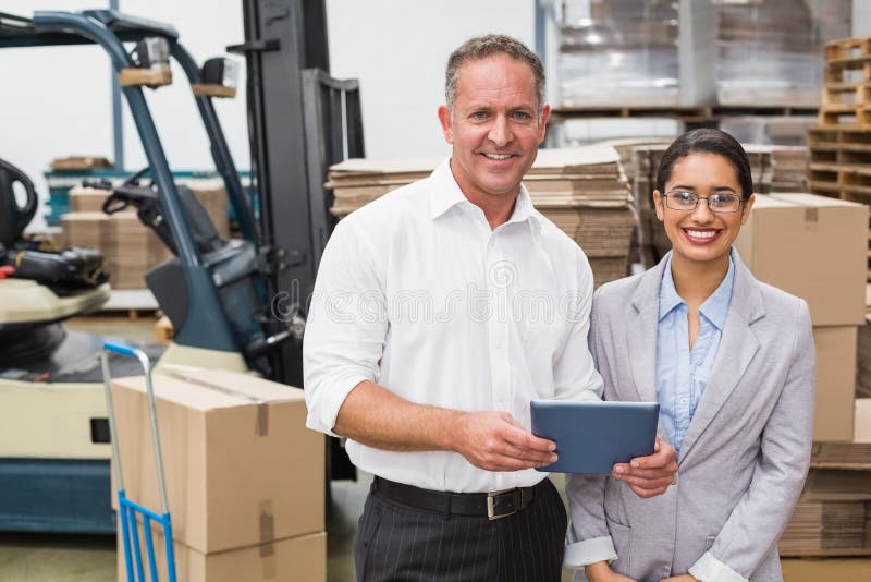 Warehouse Manager and Her Boss Working Together Stock Photo - Image of ...