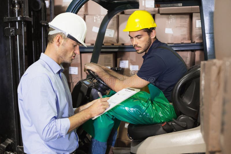 Warehouse Manager Talking with Forklift Driver Stock Photo - Image of ...