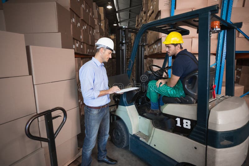 Warehouse Manager Talking with Forklift Driver Stock Image - Image of ...