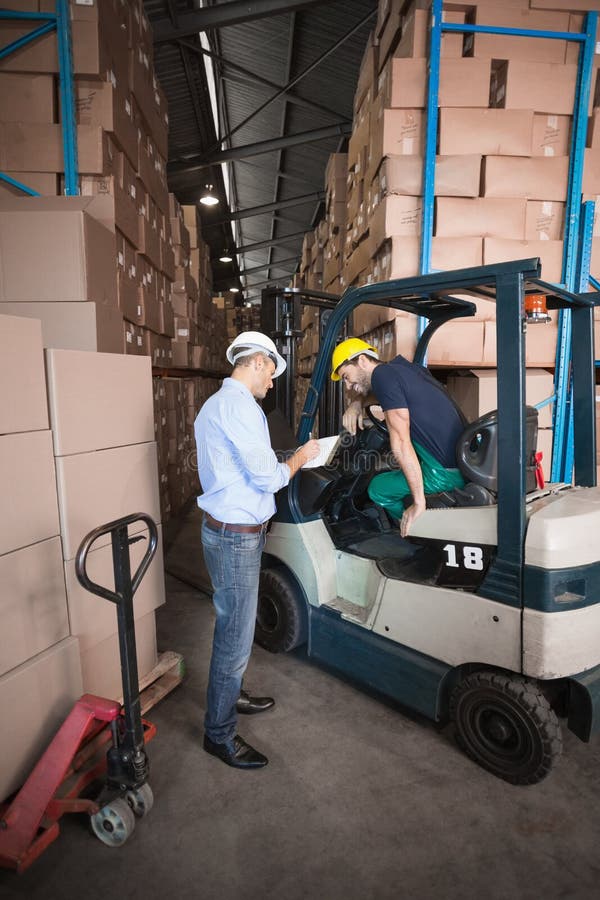 Warehouse Manager Talking with Forklift Driver Stock Image - Image of ...