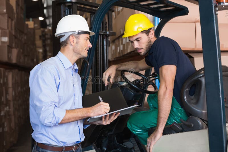 Warehouse Manager Talking with Forklift Driver Stock Photo - Image of ...