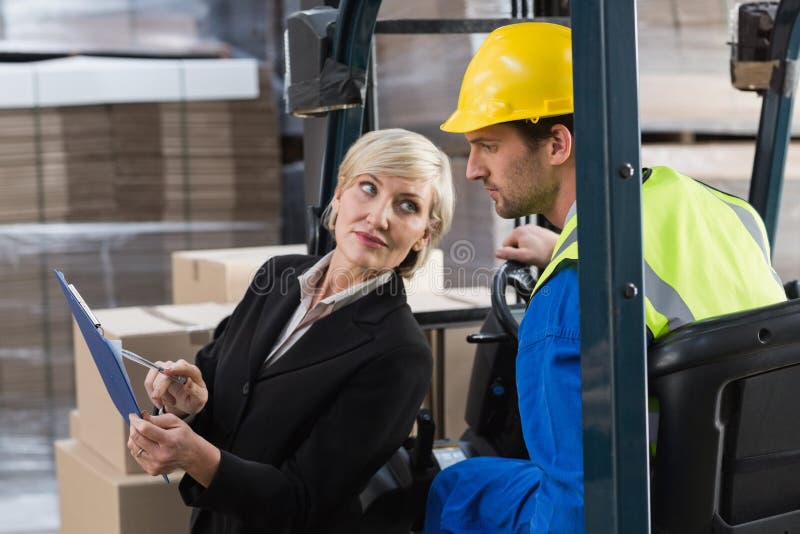 Warehouse Manager Talking with Forklift Driver Stock Photo - Image of ...