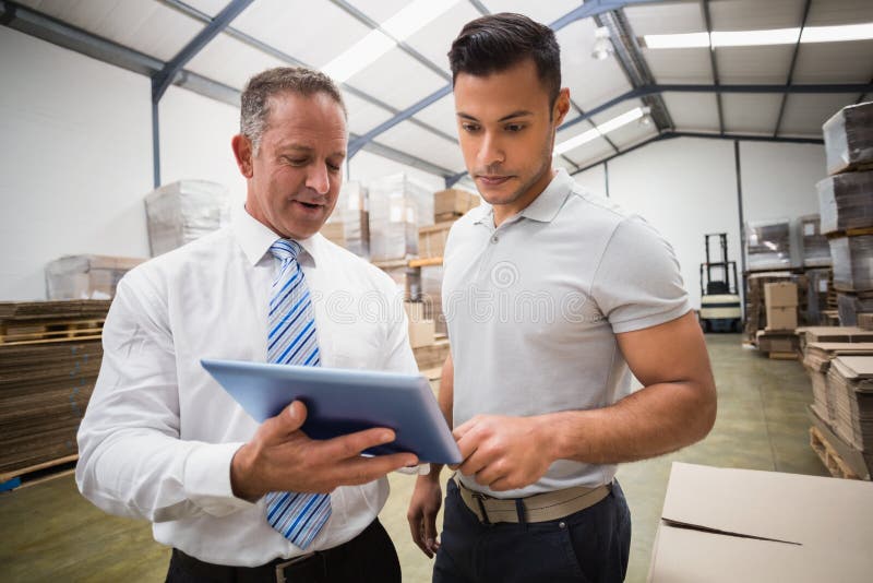 Warehouse Manager Using Tablet Pc with Colleague Stock Image - Image of ...