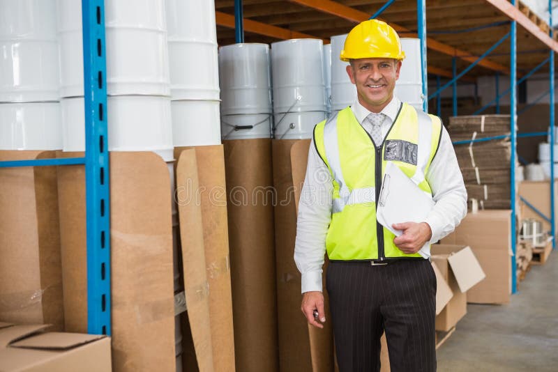 Warehouse Manager Wearing Hard Hat Holding Clipboard Stock Photo ...