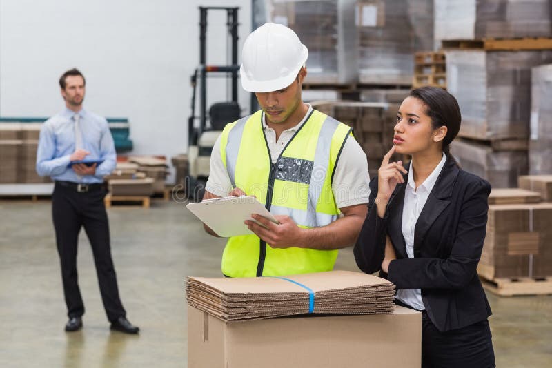 Warehouse Manager and Worker Talking Stock Photo - Image of focused ...