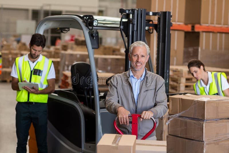 Warehouse Manager and Workers Preparing a Shipment Stock Image - Image ...