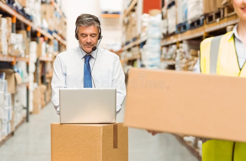 Warehouse Manager Working on Computer Stock Photo - Image of computer ...