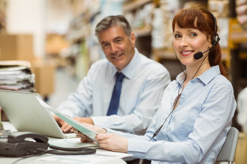 Warehouse Manager Working at Her Desk Wearing Headset Stock Photo ...