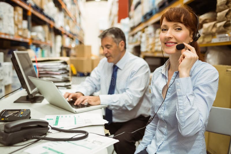 Warehouse Manager Working at Her Desk Wearing Headset Stock Image ...