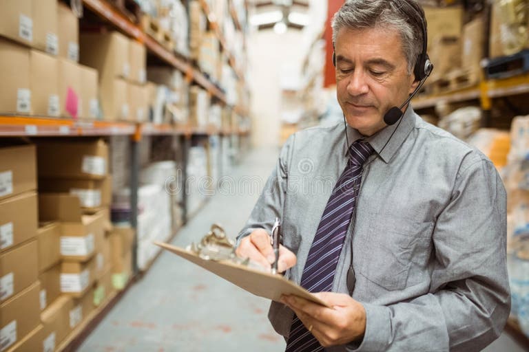 Senior Male Supervisor in Suit with Clipboard Checking Boxes on ...