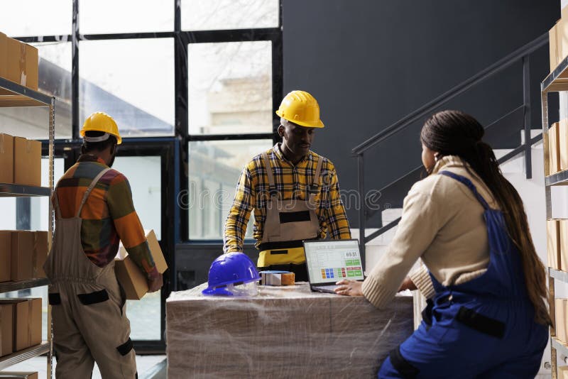 Warehouse Managers Checking Order Information on Laptop Screen Stock ...