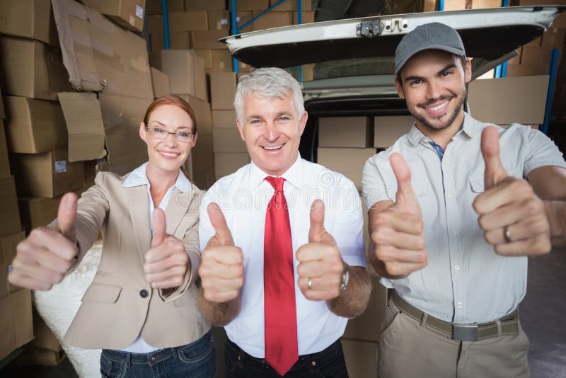 Warehouse Managers and Delivery Driver Smiling at Camera Stock Image ...