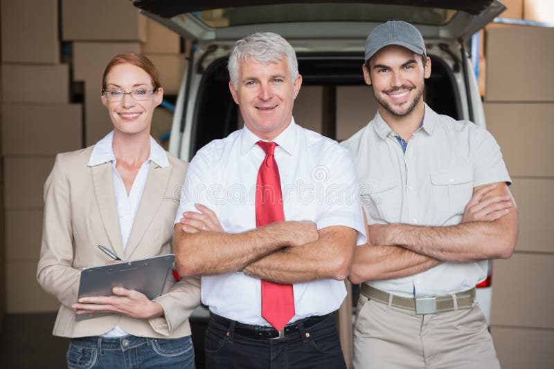 Warehouse Managers and Delivery Driver Smiling at Camera Stock Photo ...