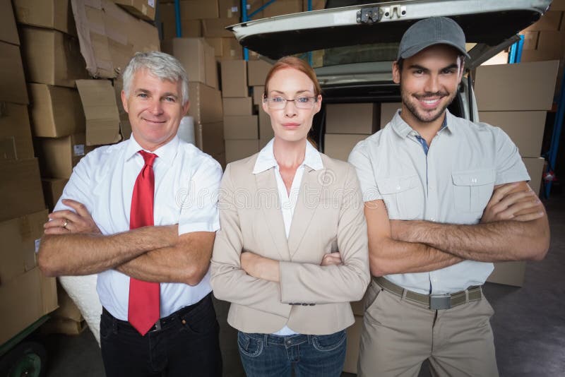 Warehouse Managers and Delivery Driver Smiling at Camera Stock Photo ...