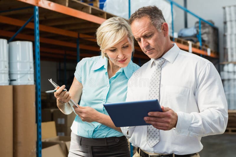 Warehouse Managers and Worker Working on Laptop Stock Image - Image of ...