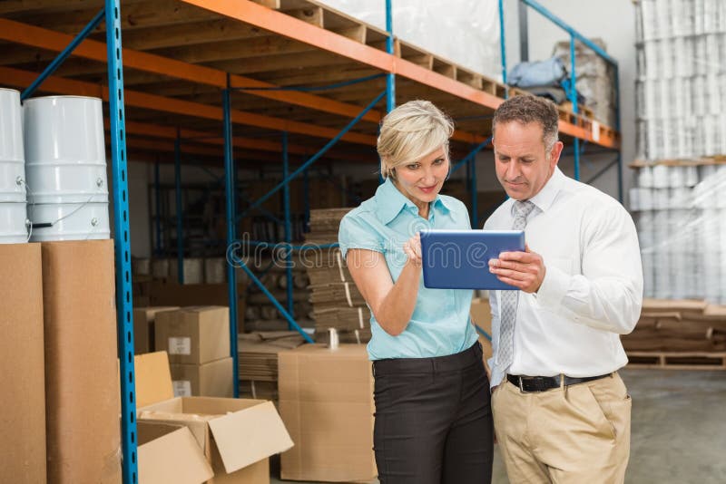 Warehouse Managers and Worker Working on Laptop Stock Image - Image of ...