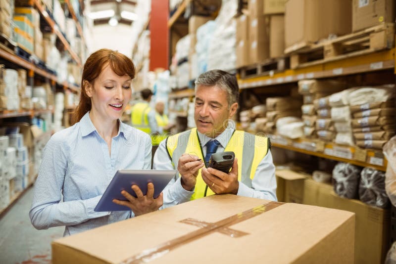 Warehouse Managers and Worker Working on Laptop Stock Image - Image of ...