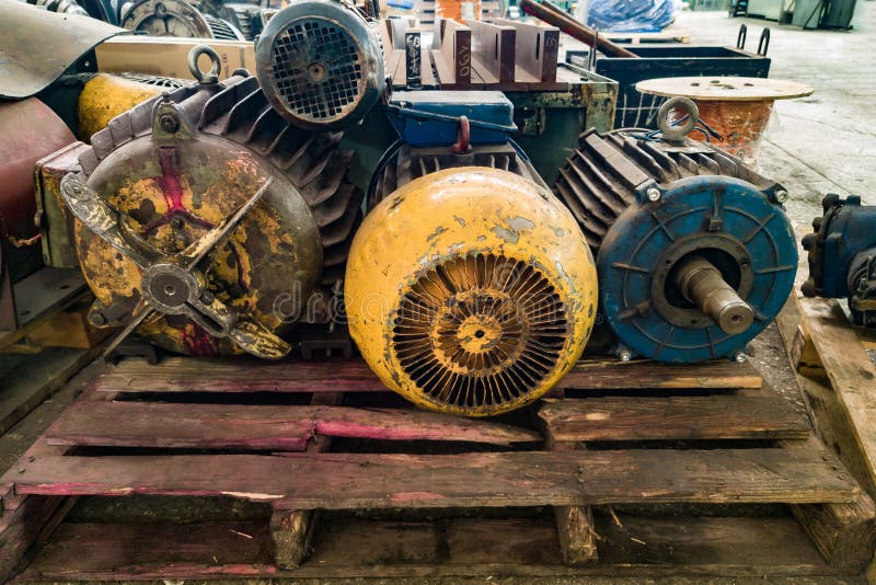 Warehouse of Old Non-working Electric Motors on Racks and on the Floor ...