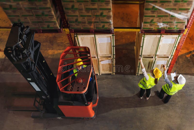 Warehouse Operation Team with Forklift Working in Storage Warehouse ...