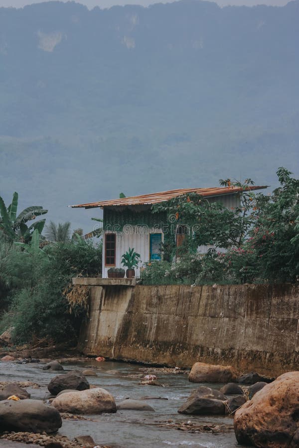 A Warehouse on the River Bank and Under the Foot of the Mountain Stock ...