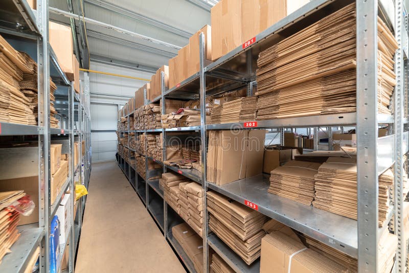 Warehouse Shelves with Cardboard Boxes and Packs in Paper Packaging ...