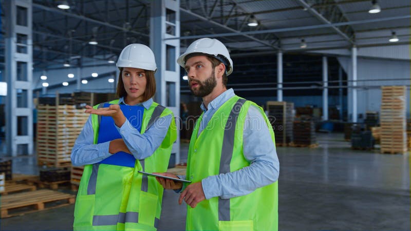 Warehouse Specialists Checking Factory Production Holding Tablet Papers ...