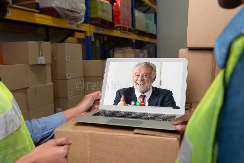 Warehouse Staff Talking on Video Call at Computer Screen in Storage ...